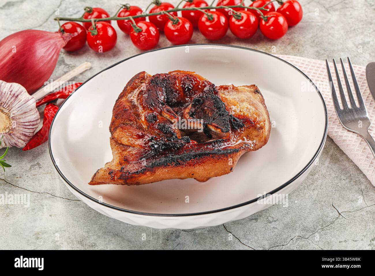 Roasted pork knuckle steak with bone Stock Photo - Alamy