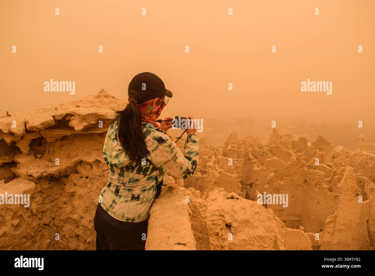Siwa Oasis, Egypt, 29 April 2025. A visitor watches the old city of ...