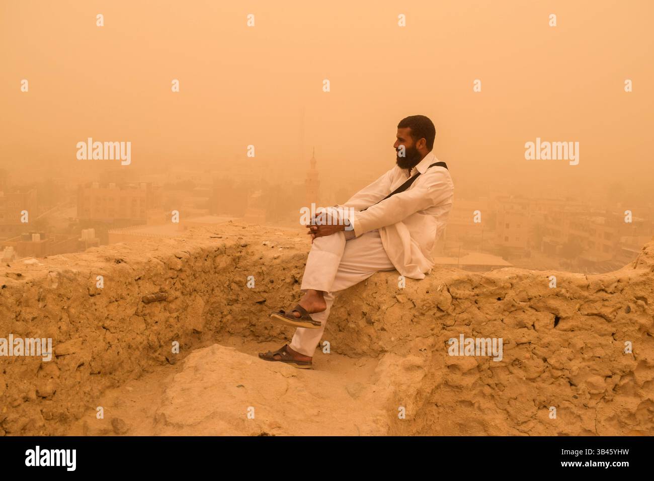Siwa Oasis, Egypt, 29 April 2025. A local is seen watching the city of ...