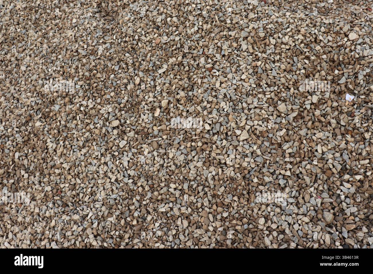 Close-up view of many small crushed gravel stones, creating rough ...