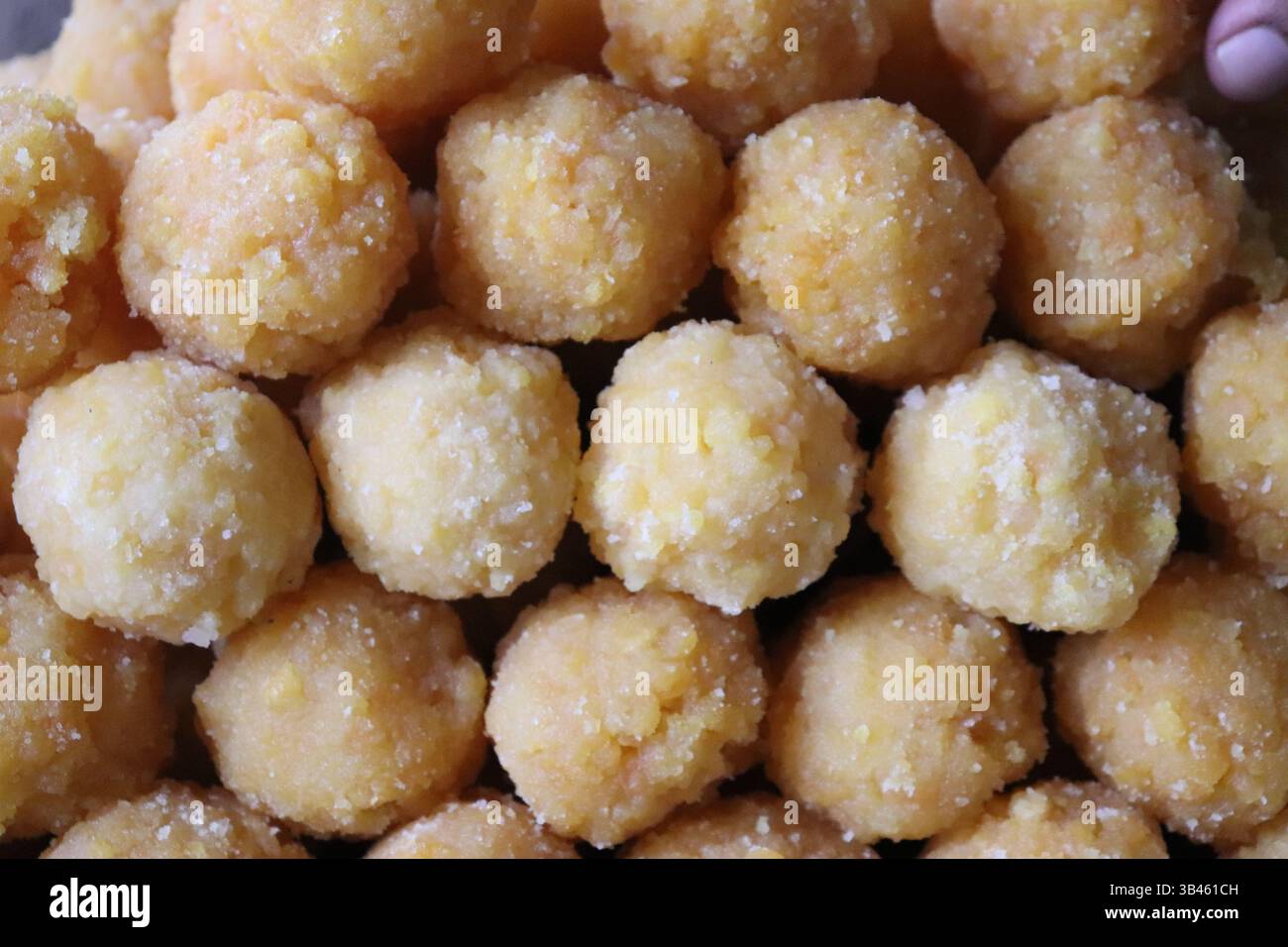 Heap of round Indian sweets, Motichoor Ladoo with sugary granules ...