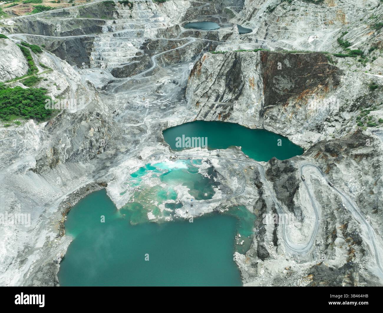 Open pit mine industry. Limestone quarry with backhoe and truck in ...