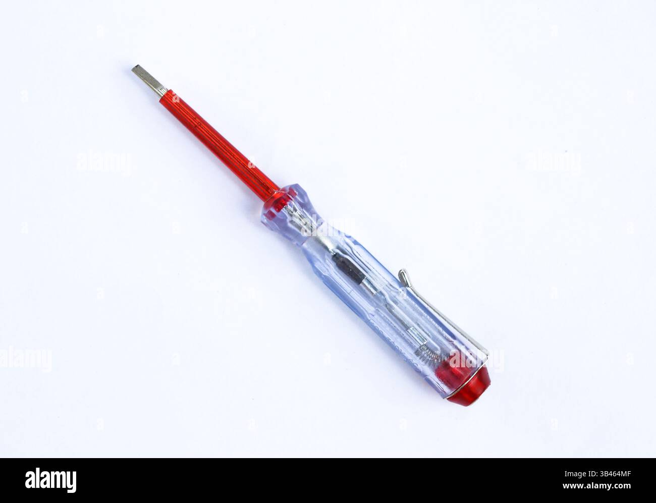 Close-up displays a red and clear electrical tester screwdriver with a ...