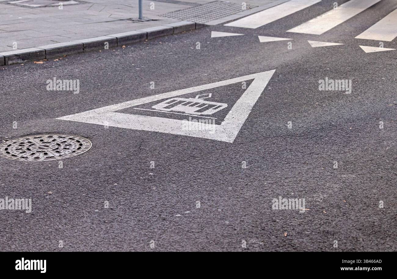 White Paint Tram Sign Road Markings at Street Stock Photo - Alamy