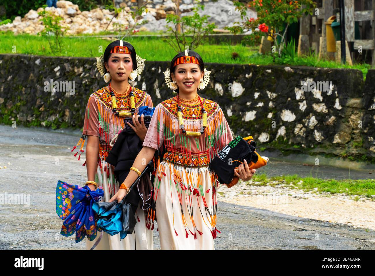 Lemo village, two Torajan women wearing traditional clothing are on ...