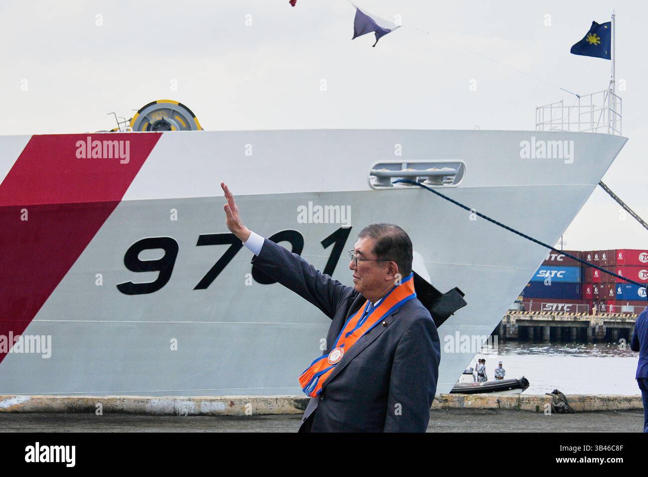 Japanese Prime Minister Shigeru Ishiba waves beside a Philippine Coast ...