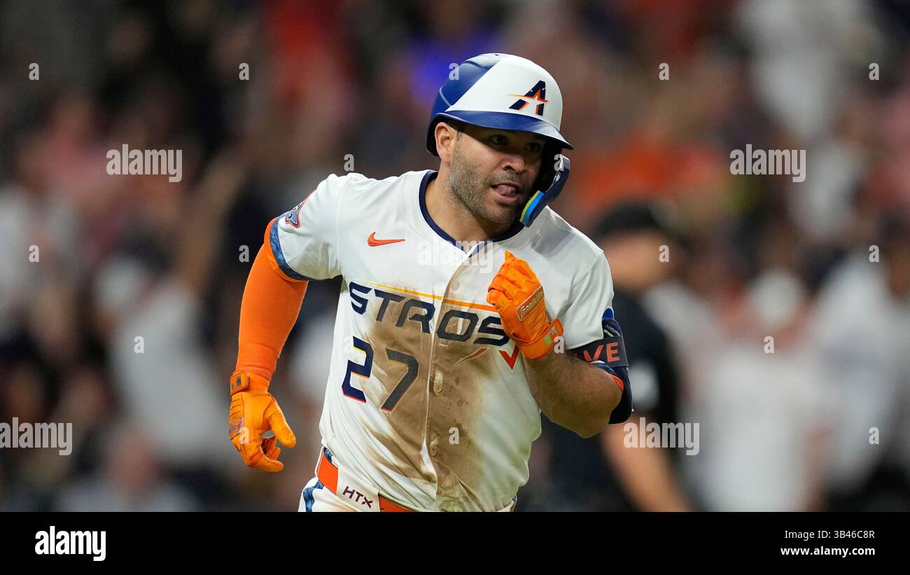 Houston Astros' Jose Altuve runs up the first base line during the ...