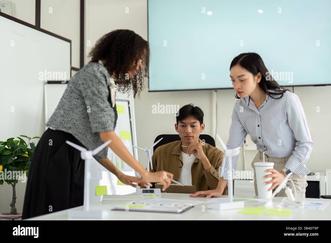 Sustainability and ESG collaboration shown through focused teamwork ...