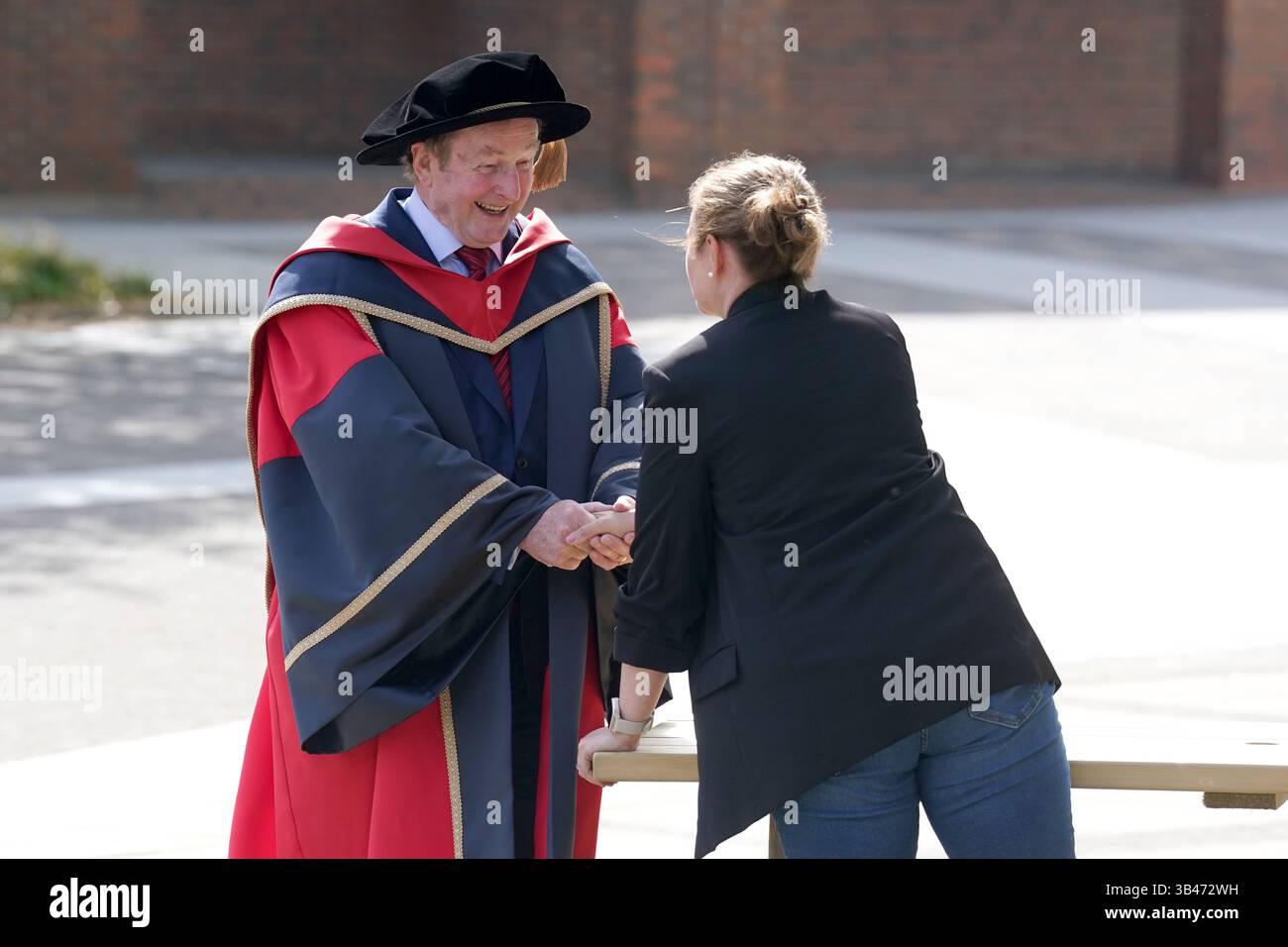 Former Taoiseach Enda Kenny is greeted as he arrives at Dublin City ...