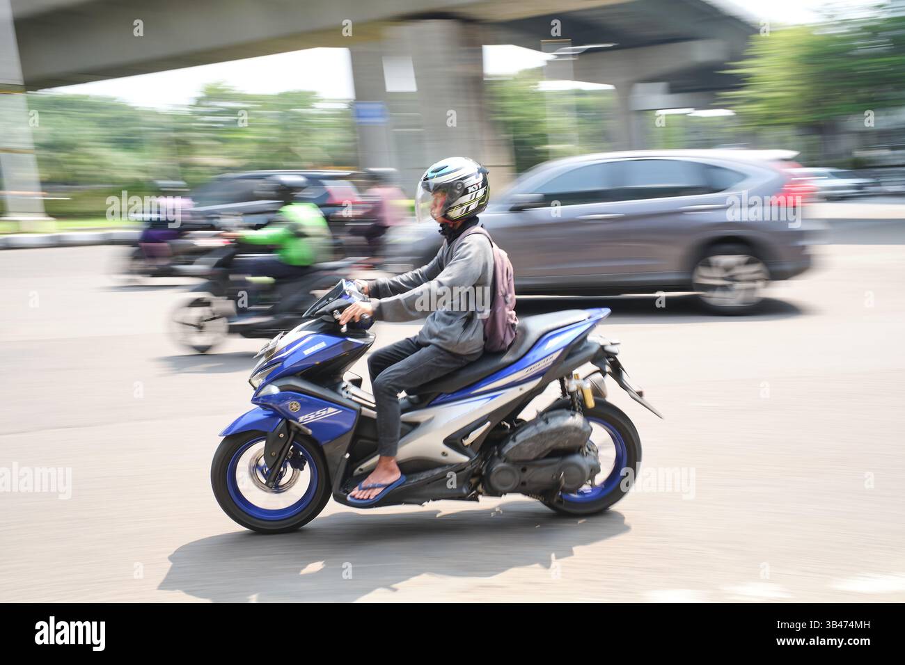 Fast moving Motorcycles or Bikers while background is in motion blur on ...