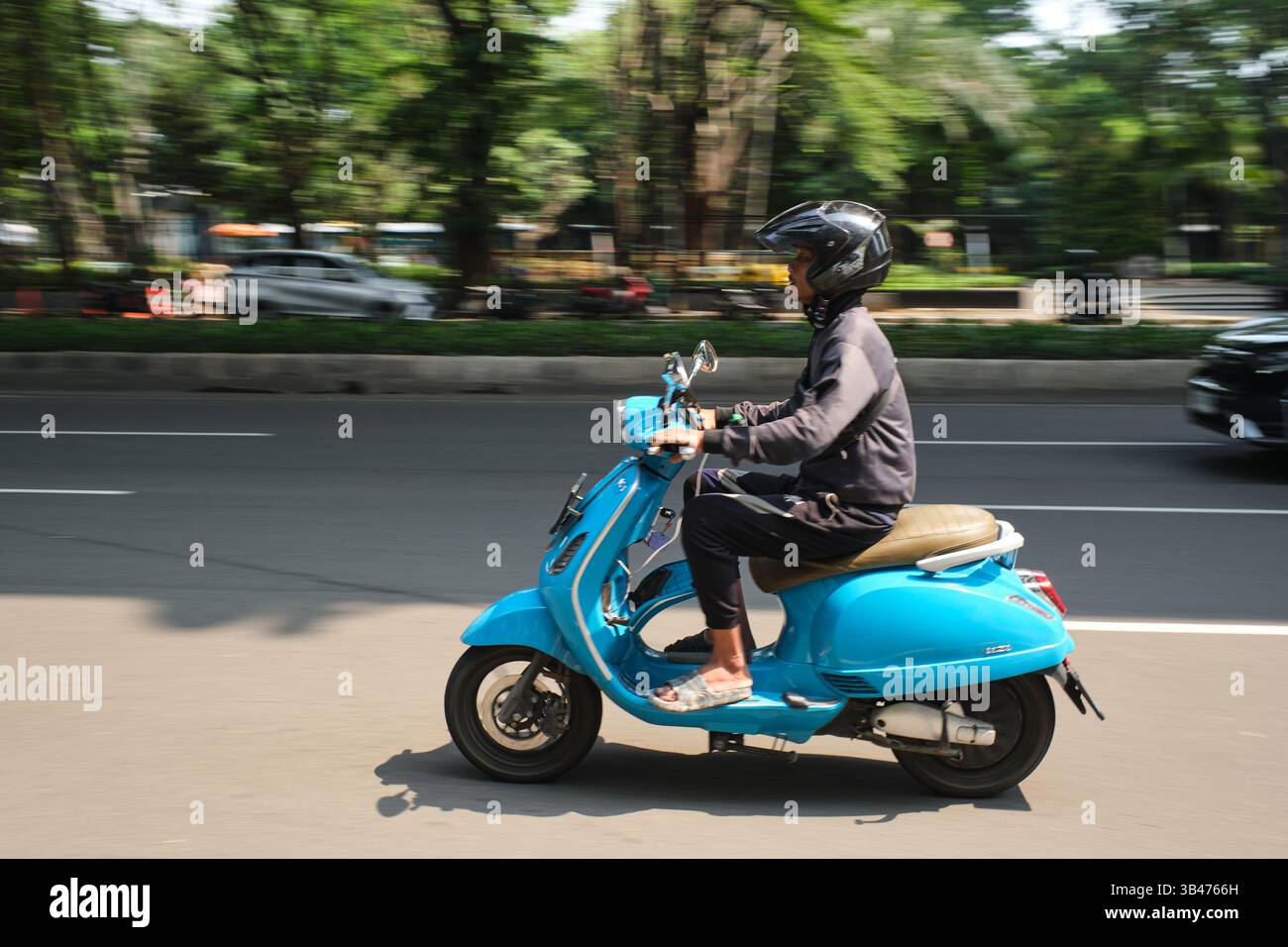 Fast moving Motorcycles or Bikers while background is in motion blur on ...