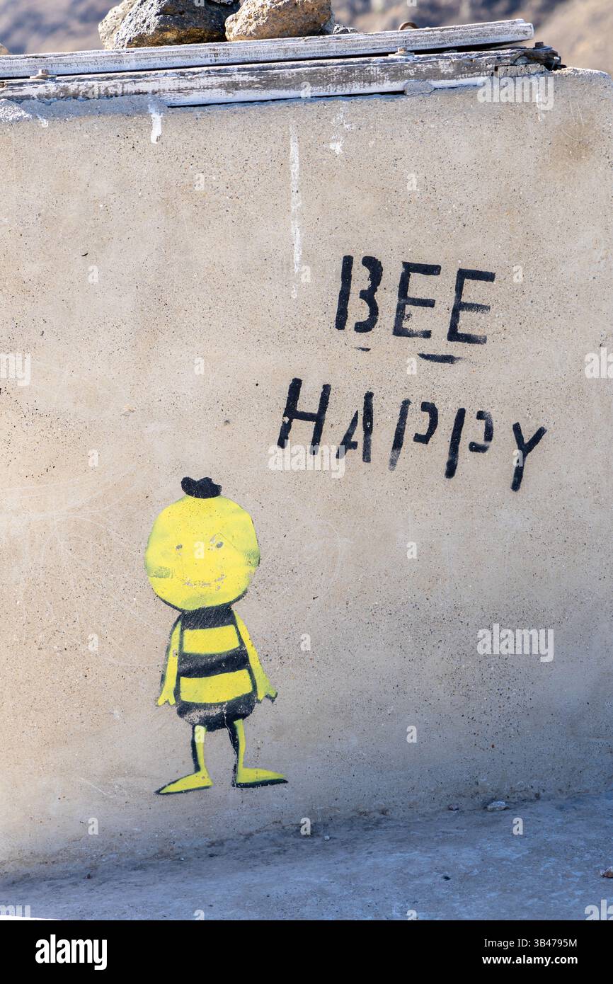 Cute Bee Street Art with Happy Message Along the Scenic Santorini Path ...