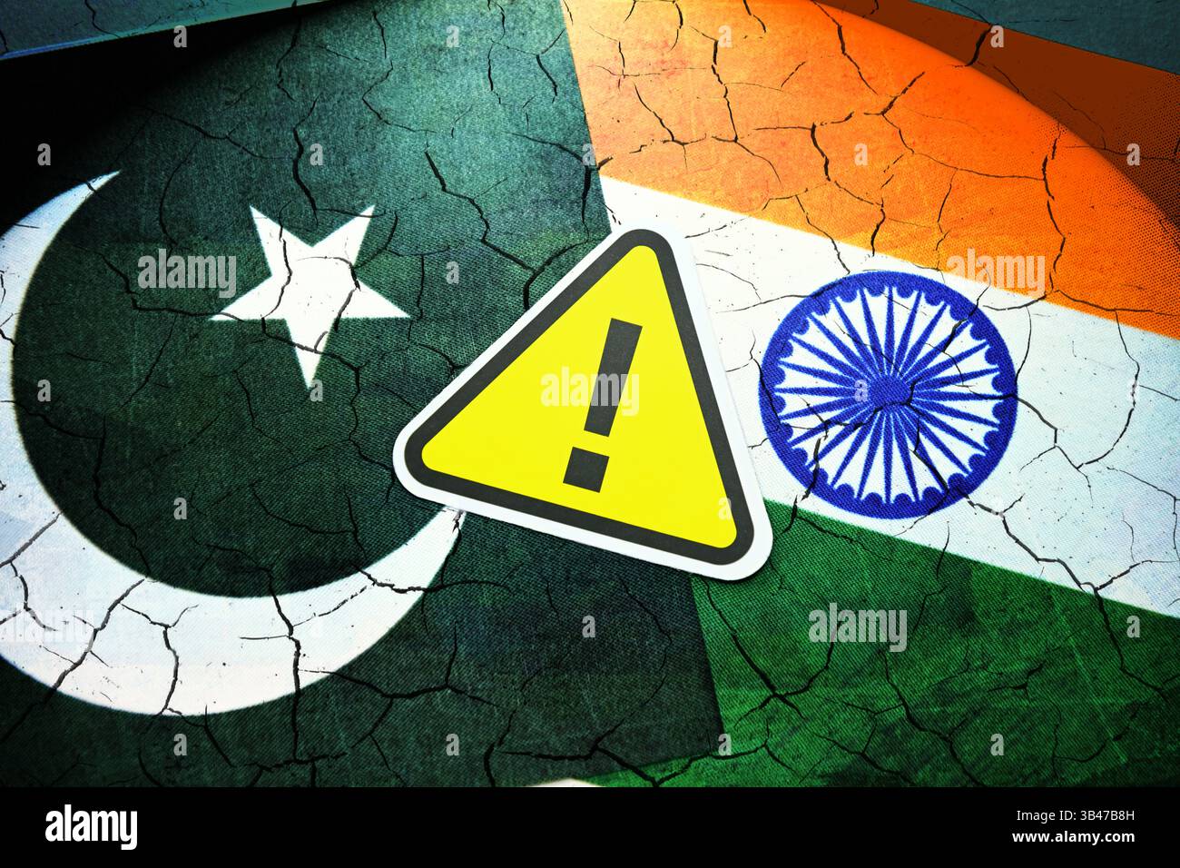 Danger sign with exclamation mark on the flags of Pakistan and India ...