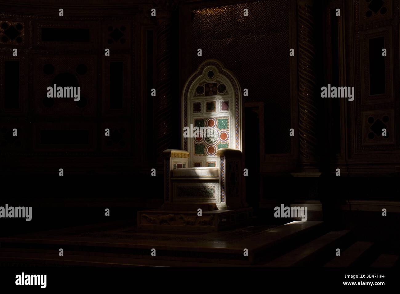 A stream of light illuminates the Pope's chair, known as the cathedra ...