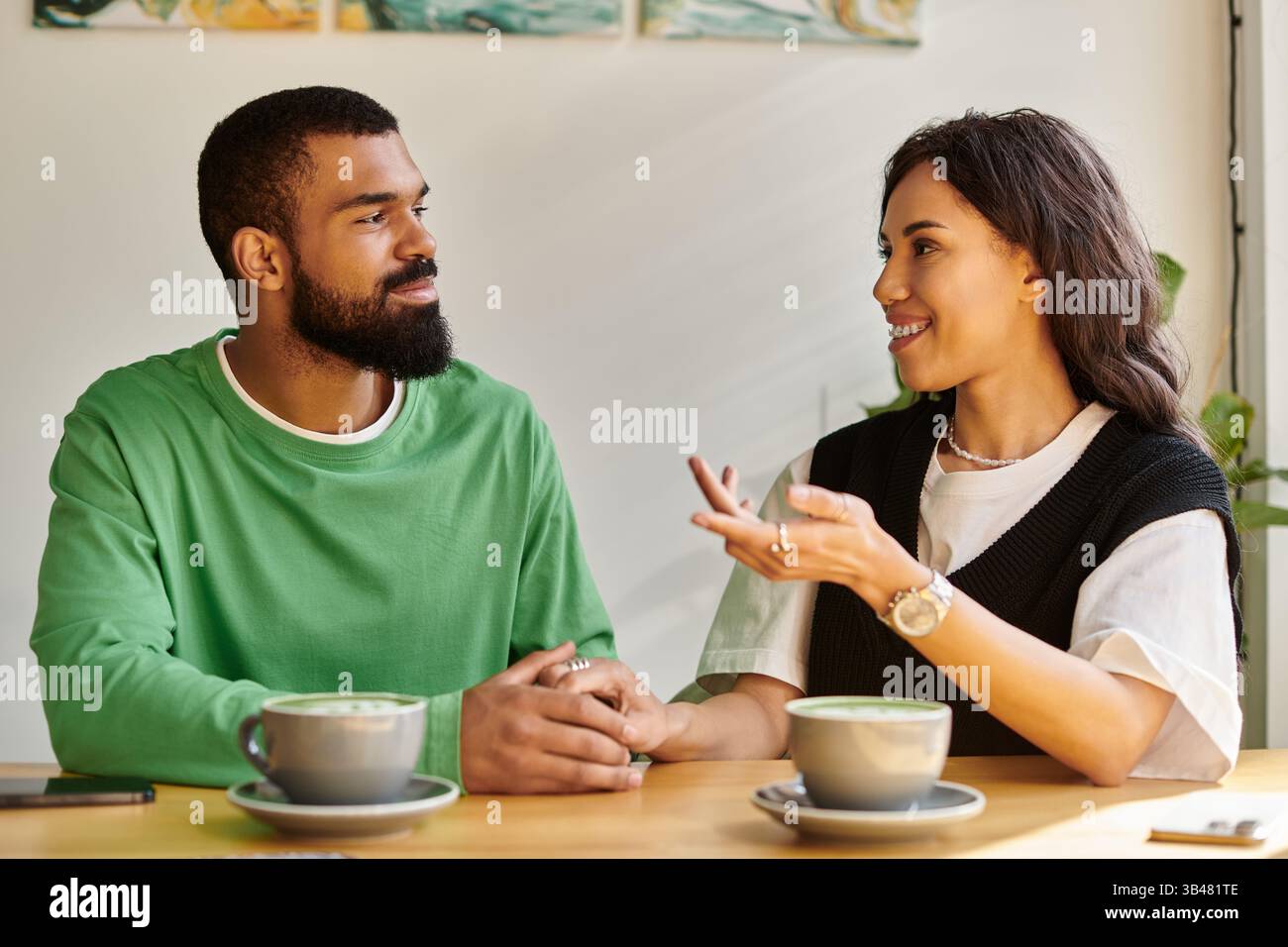 An African American couple enjoys a warm conversation over coffee in a ...