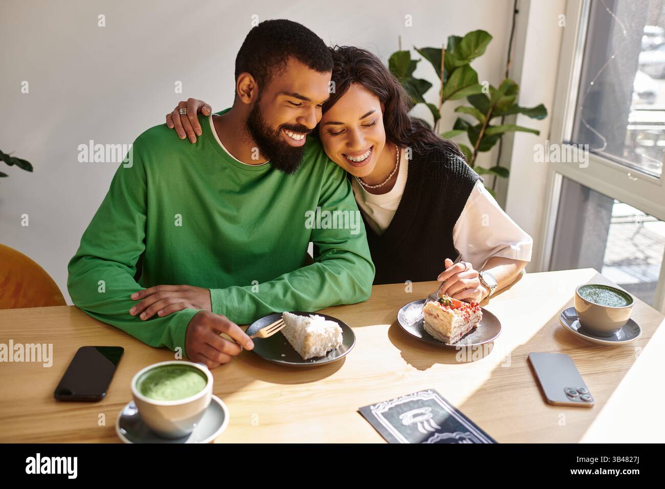 Couple enjoys sweet desserts while laughing and sharing warmth at a ...