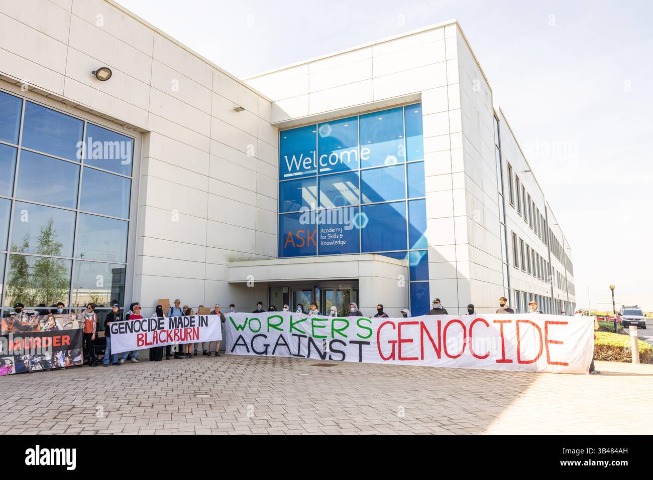 Samlesbury, UK. 30 APR, 2025. Activists hold banners outside the ...