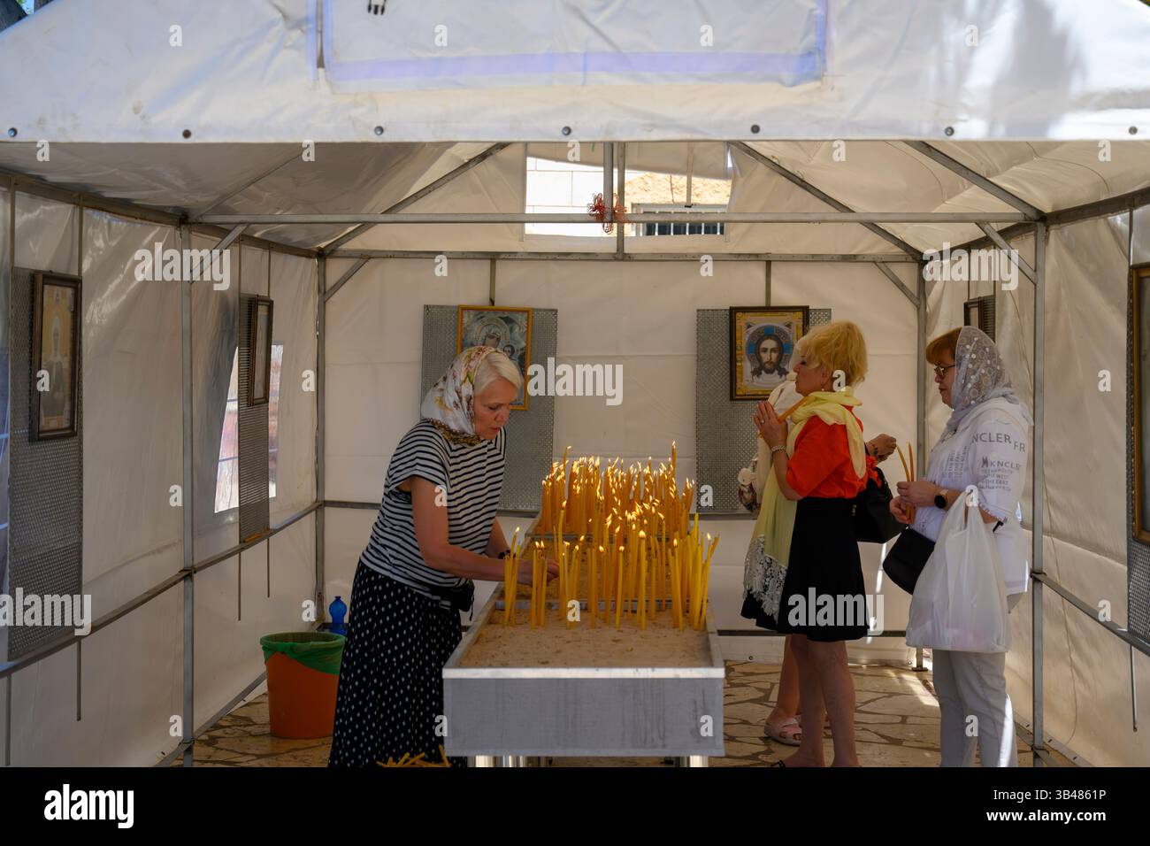 lighting candles Easter celebrations in the courtyard at the Church of ...