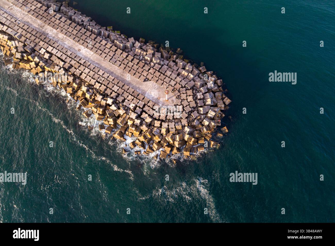 top down view of a breakwater and ocean waves, aerial drone photo Stock ...
