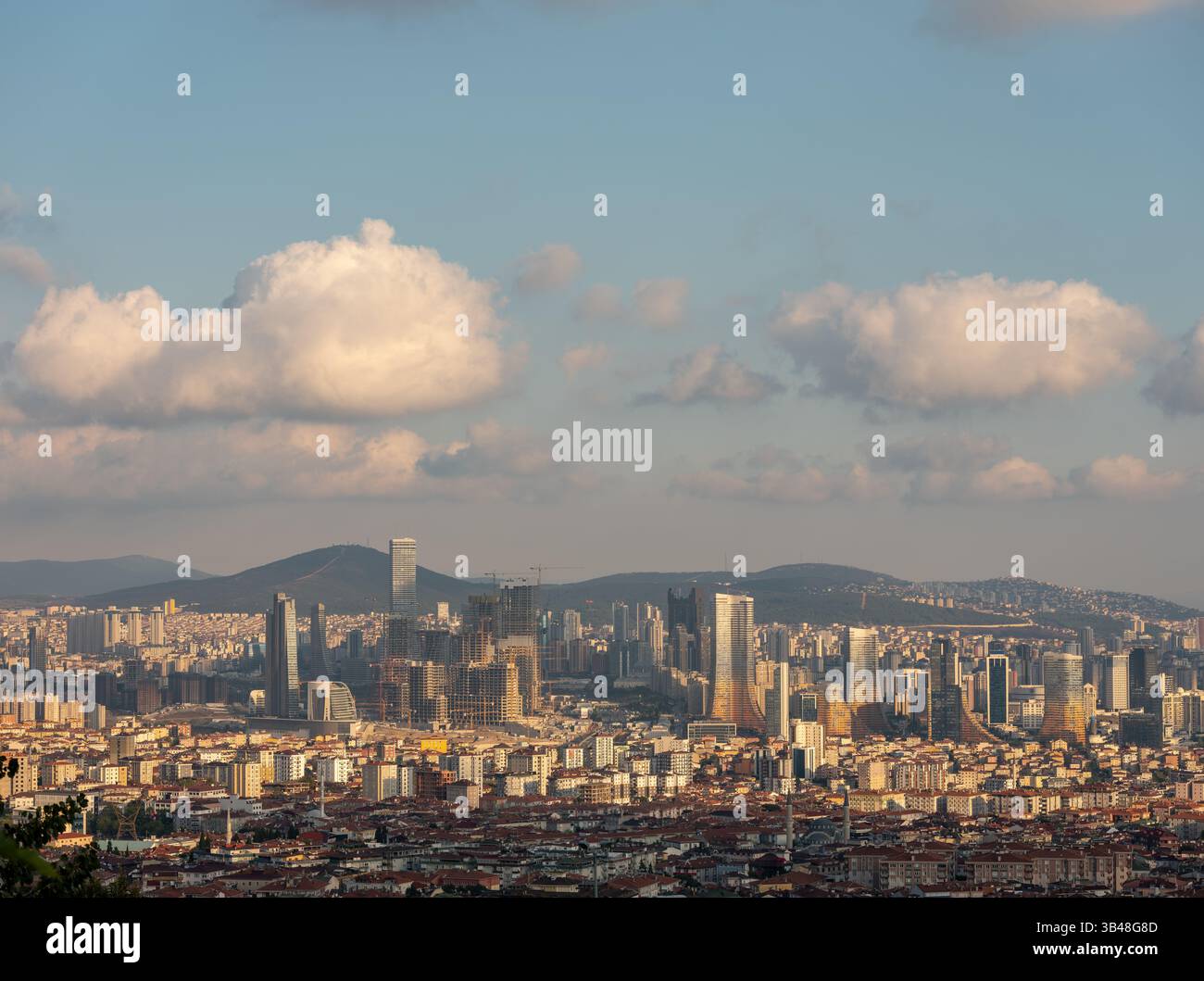 Modern cityscape with skyscrapers and ongoing construction projects ...