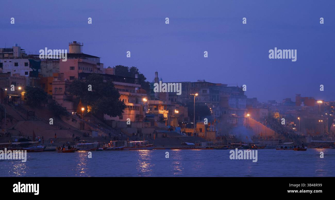 Varanasi, Uttar Pradesh, India. People walking on steps on Shivala Ghat ...