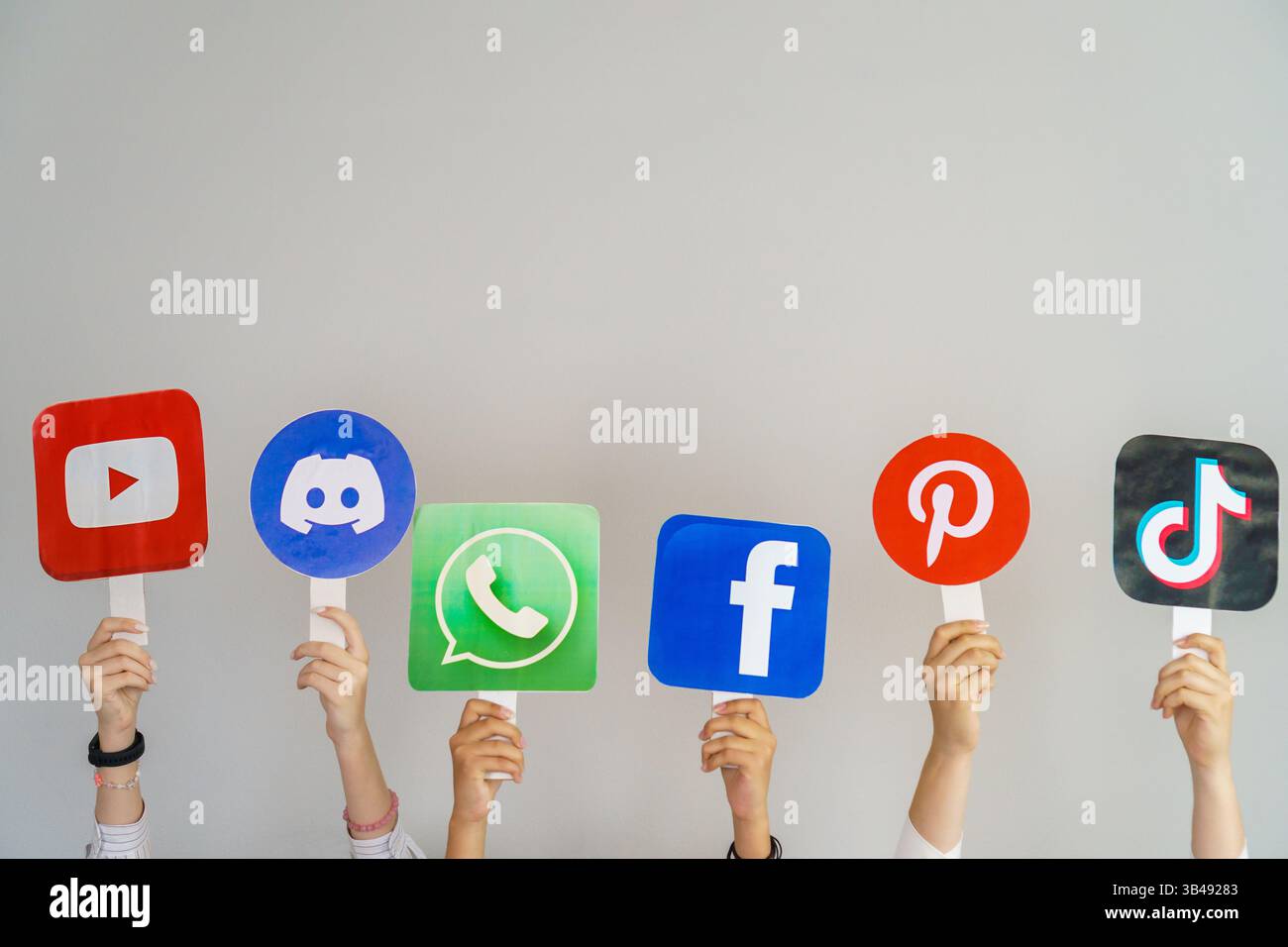 Teenagers hold signs with logos of famous and popular social networks ...