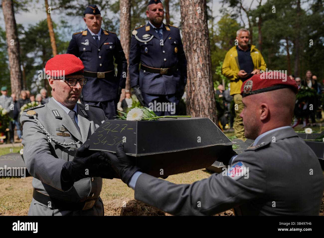 German soldiers carry the Small coffins with the remains of fallen ...