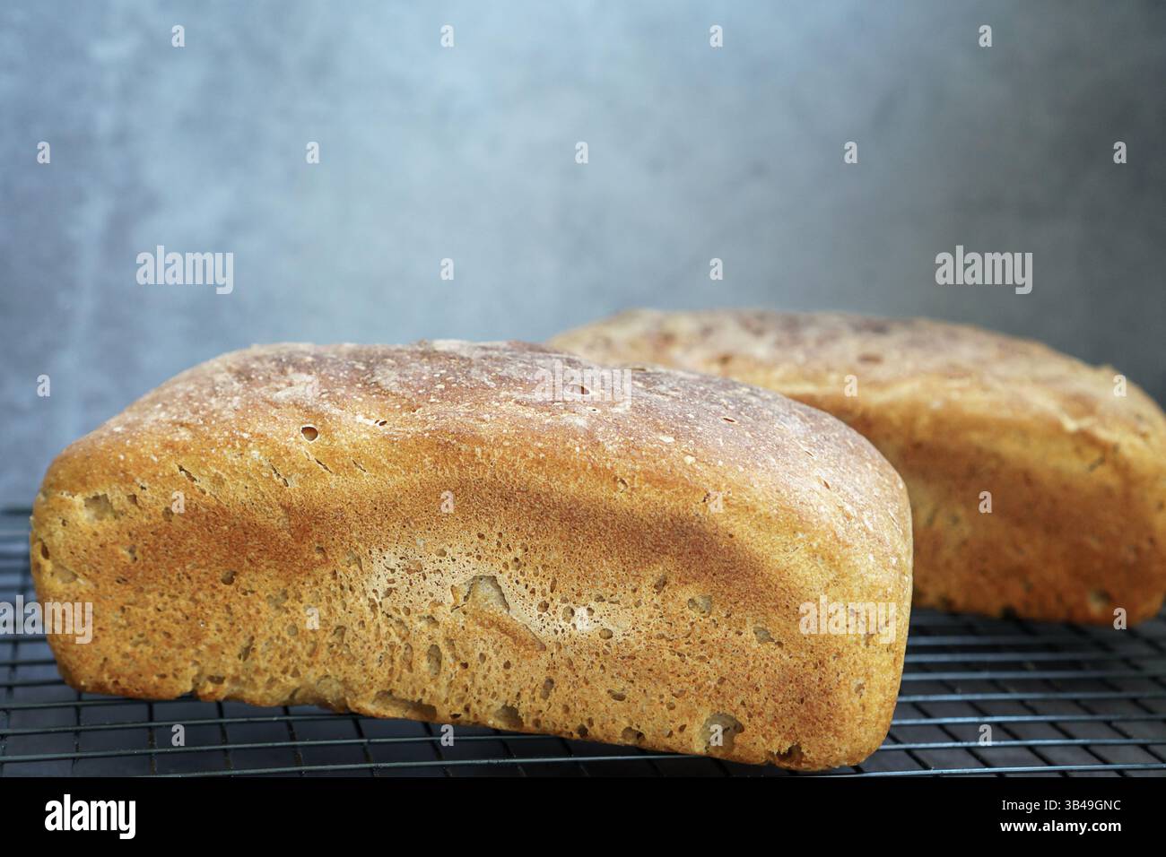 sourdough rye bread rectangular brick shape on a black background Stock ...