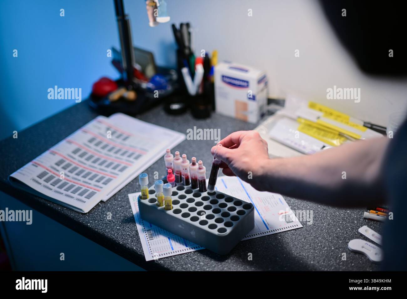 Berlin, Germany. 29th Apr, 2025. A doctor places a blood ampoule for a ...
