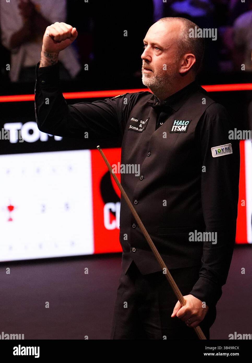 Mark Williams celebrates winning his game against John Higgins, on day ...