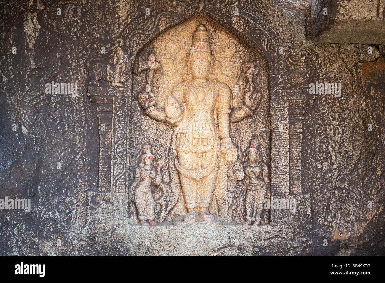 Ancient sculpture at a temple of Hampi, carved into boulder of ...