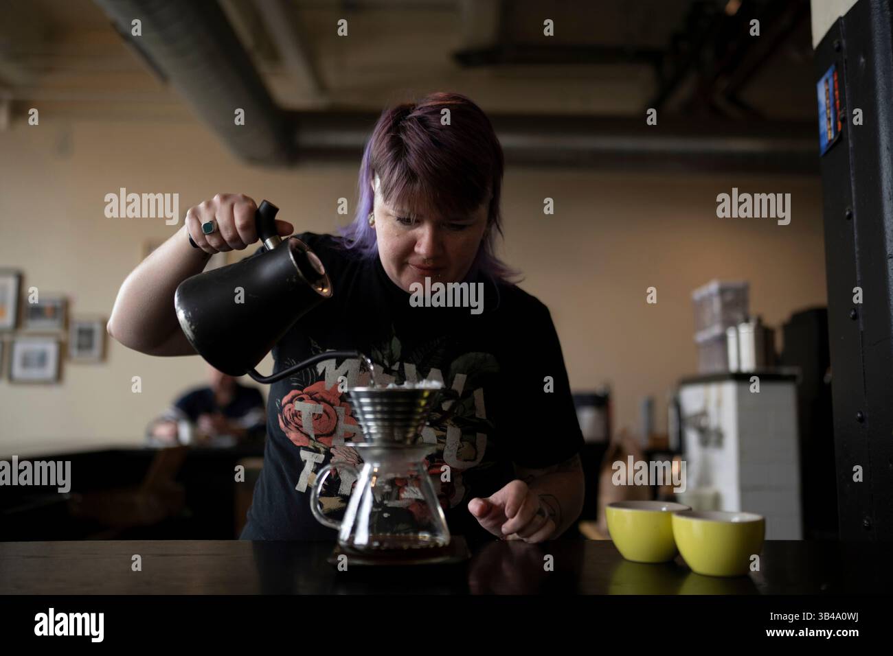 Renee Colon, co-owner of Fuego Coffee Roasters, makes a cup of coffee ...