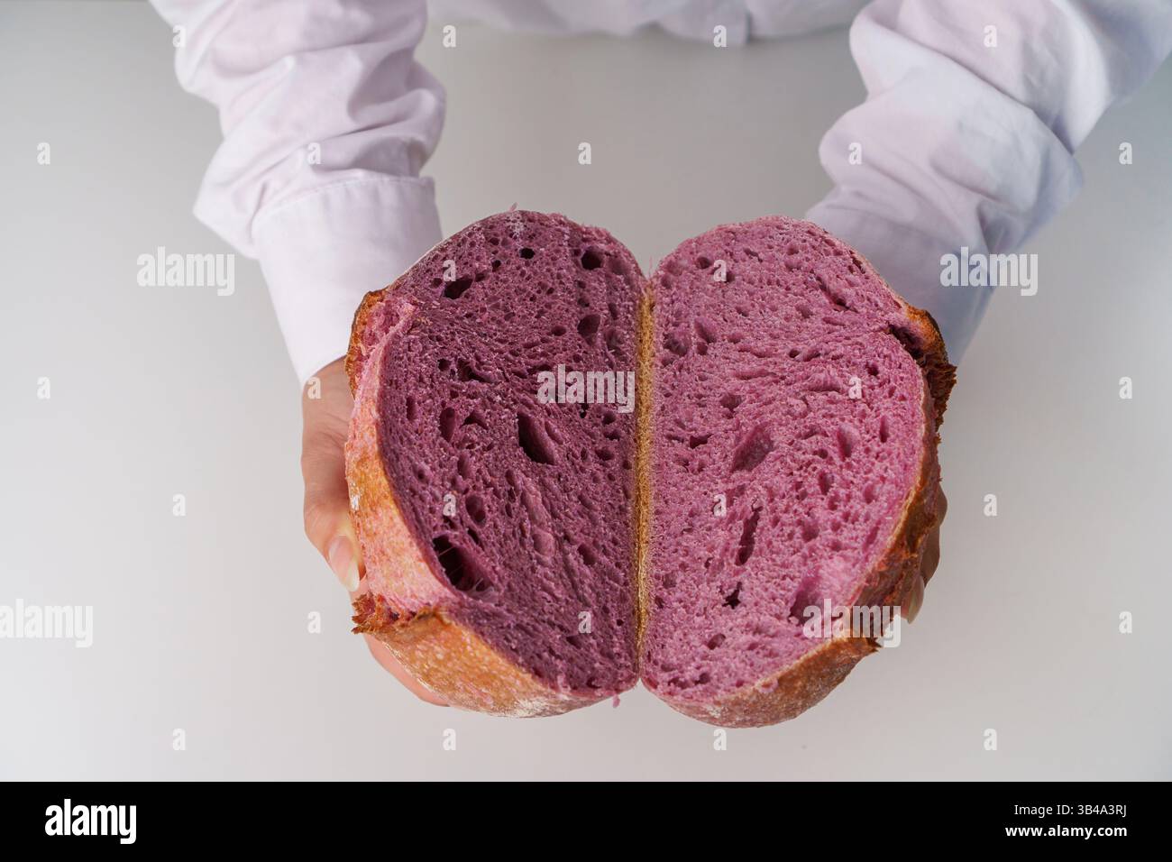 Pink Unusual and creative colored artisan sourdough bread cut in the ...