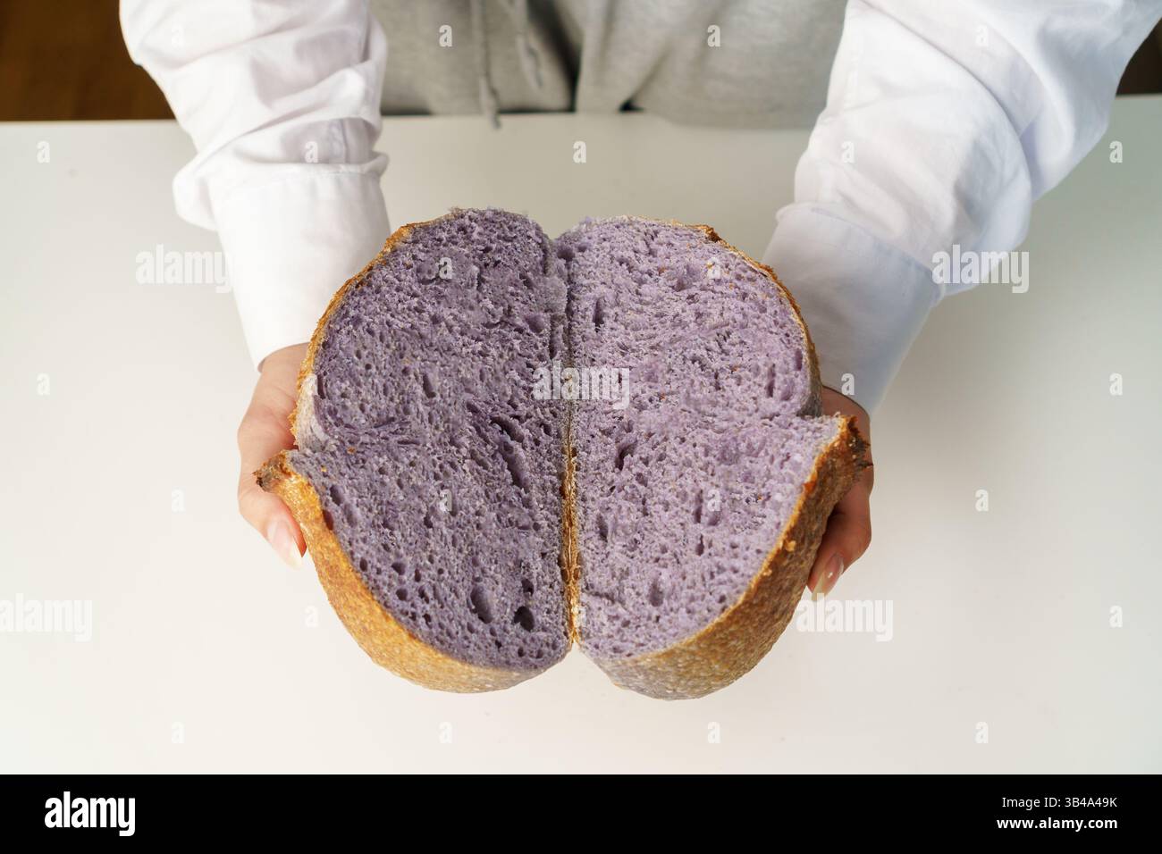 Purple Unusual and creative colored artisan sourdough bread in a cross ...