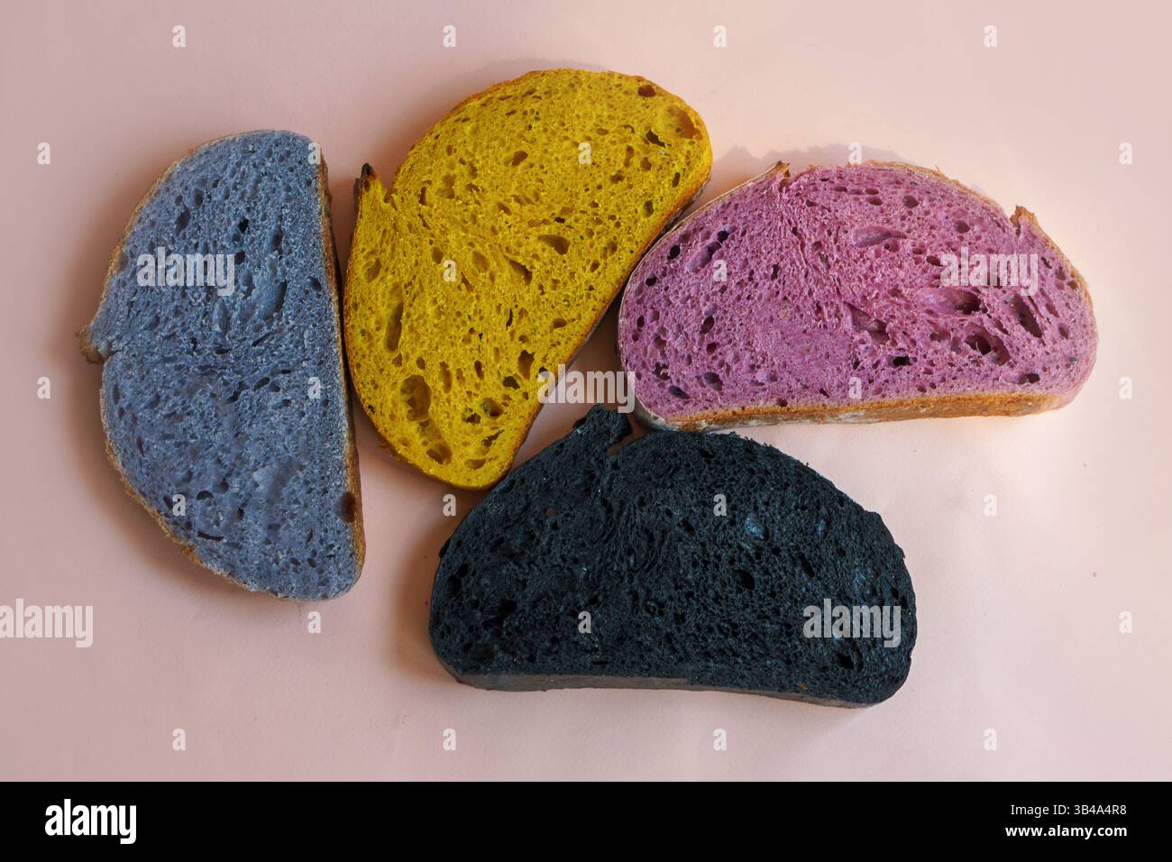 Sourdough bread loaf, artisan colorful bread cut into pieces , top view ...