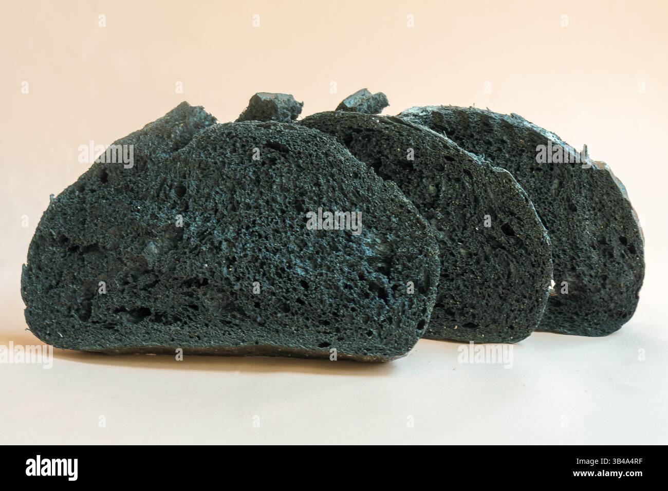 Freshly baked homemade Unusual and creative black artisan sourdough ...