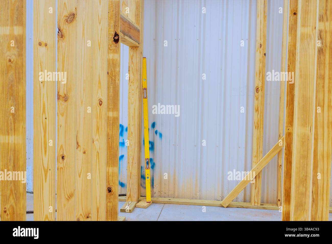 Construction of wooden frame structure is underway is vertical beams ...