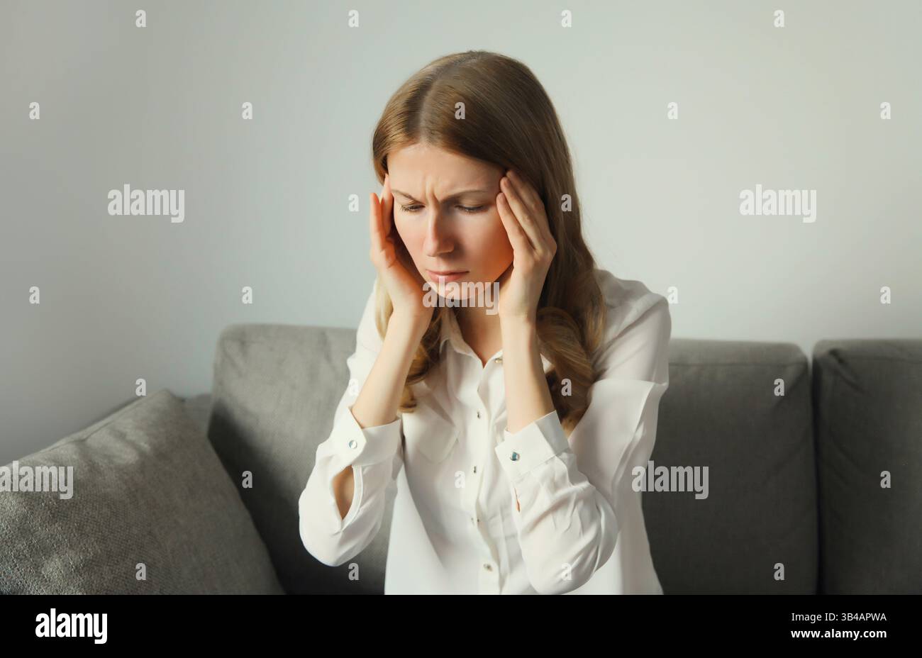 Exhausted tired woman touching head, suffering from headache, stress ...