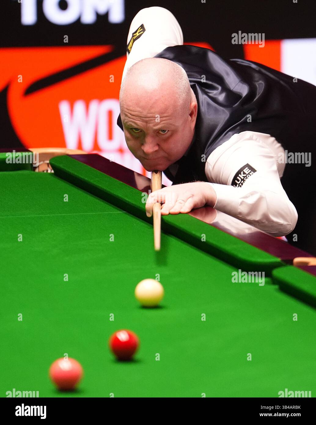 John Higgins plays a shot during his game against Mark Williams , on ...