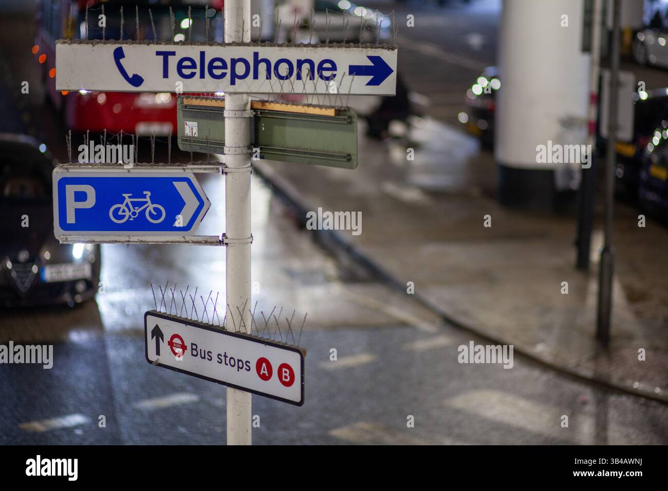 signage and bus stops at train station Stock Photo - Alamy