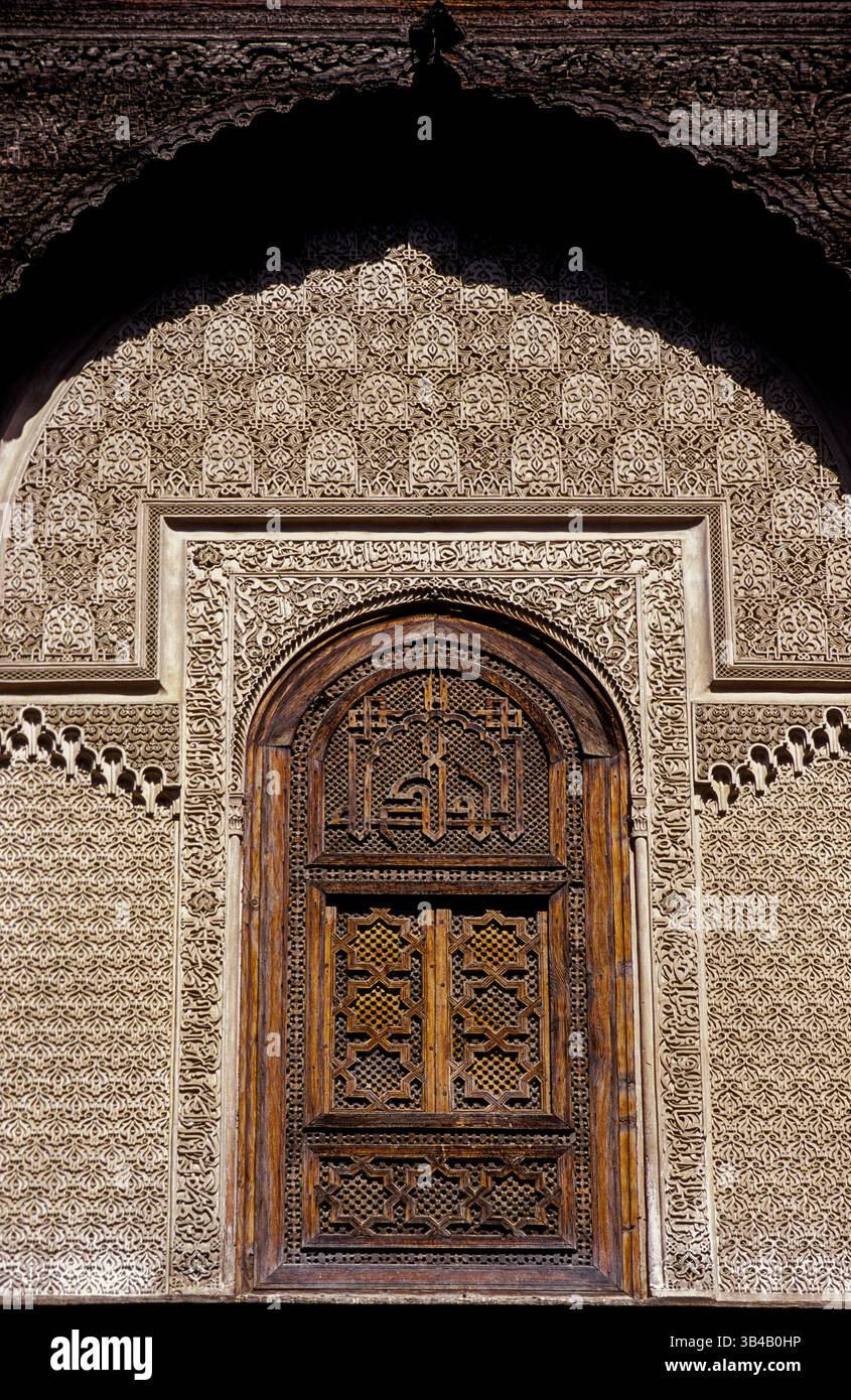 Carved cedar wood surrounded by Koranic calligraphy and elaborate ...