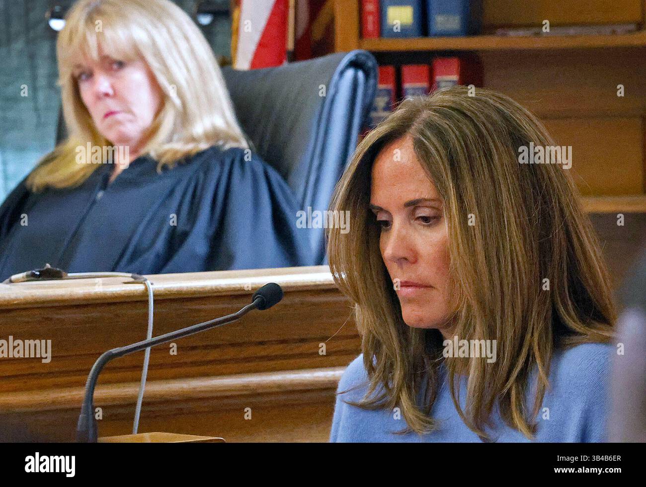 Jen McCabe of Canton sits on the witness stand listening to her 911 ...