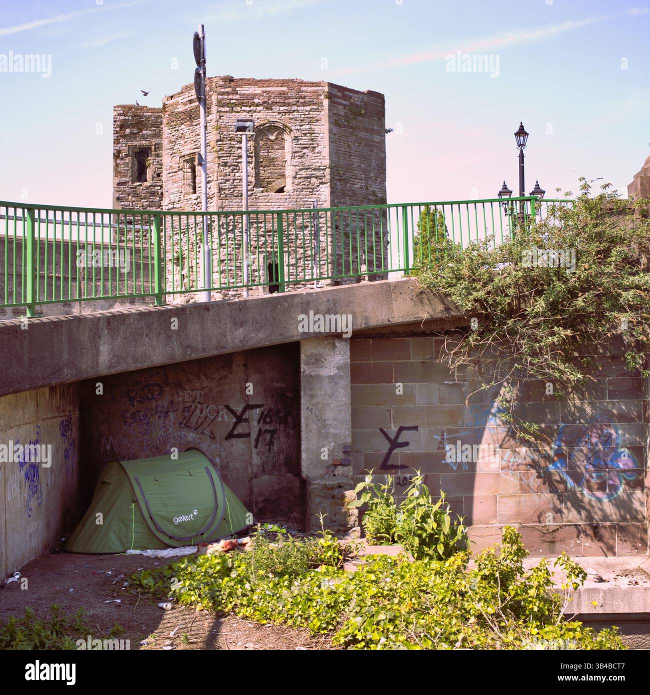 Homeless. Green tent pitched under the arches, near Newport Castle ...
