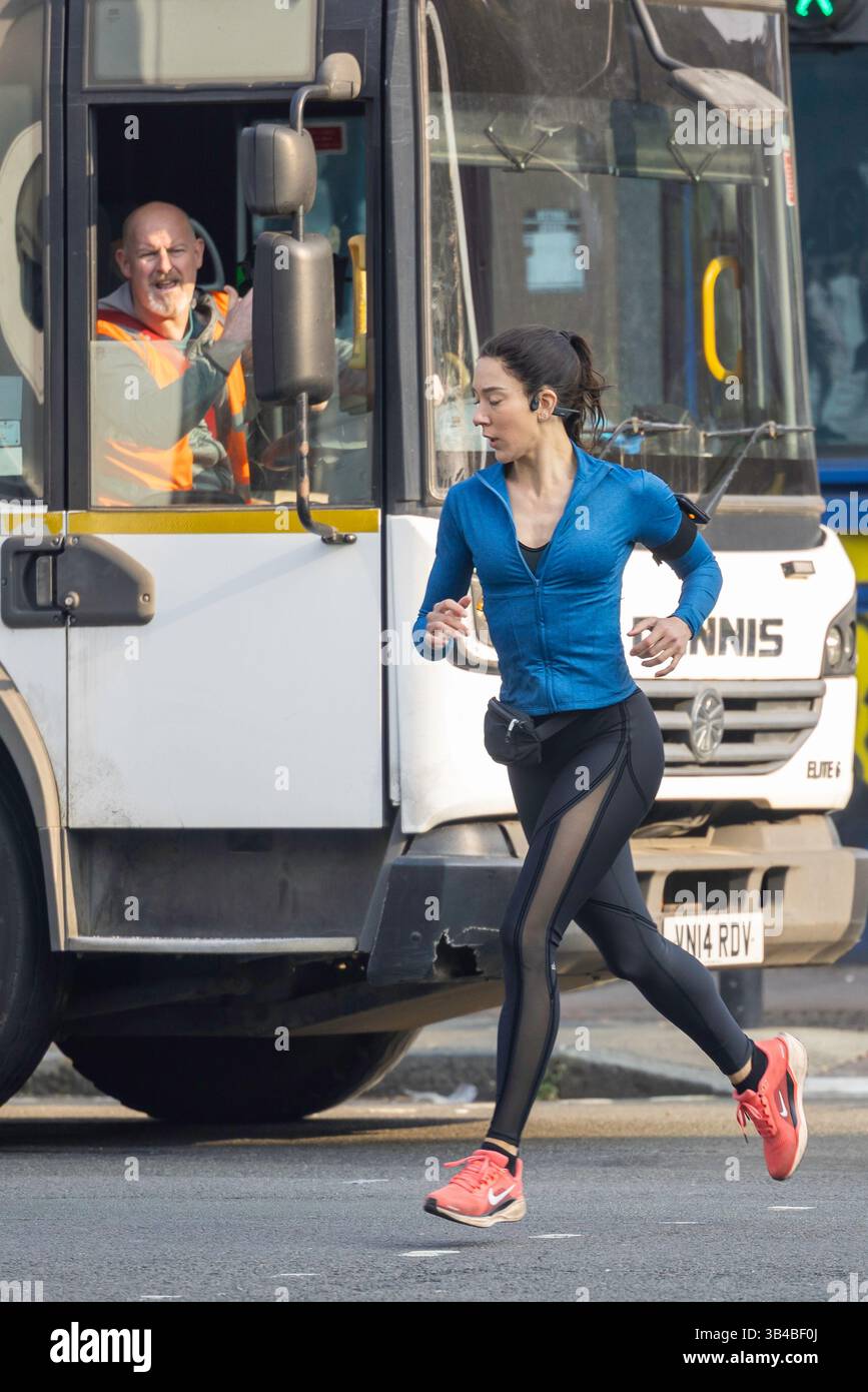 Gal Gadot filming a scene for 'The Runner' in Camden, London, wearing a blue running top and ...