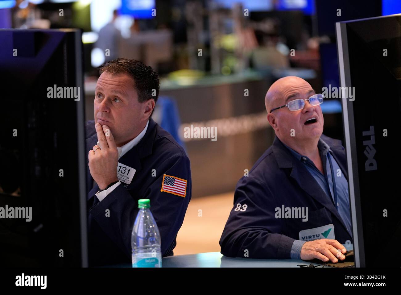 Matthew Cheslock, left, and Anthony Confusione work on the floor at the ...