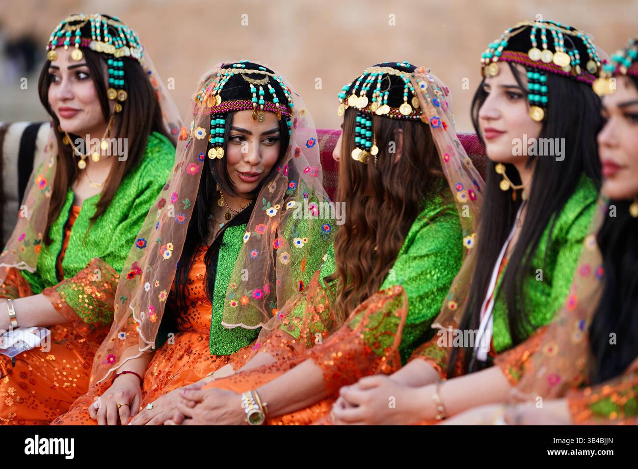 Members of the Iraqi Kurdish group from Kirkuk sit in front of Dalal ...
