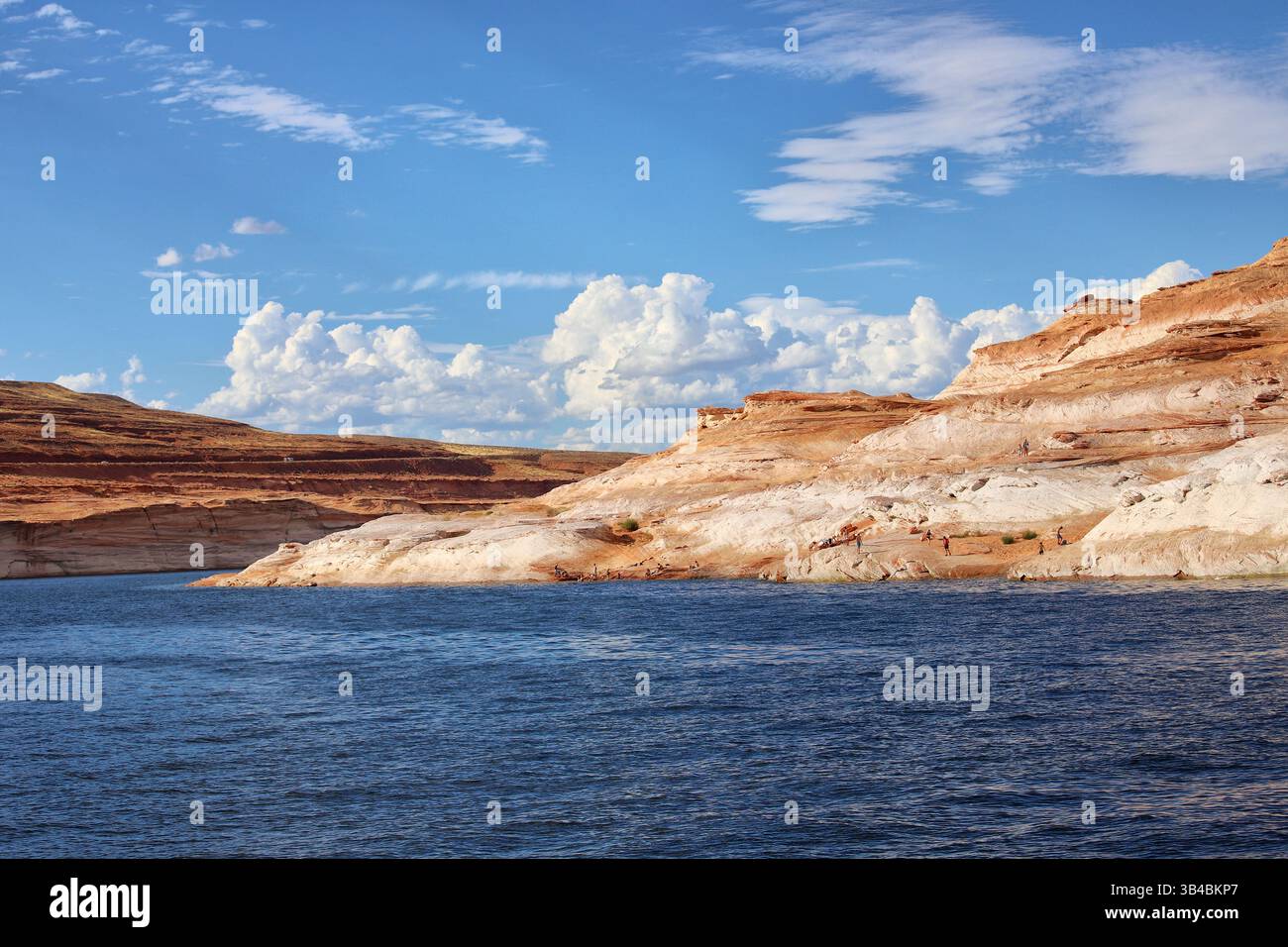 View of Lake Powell shoreline with red desert terrain, blue water and ...
