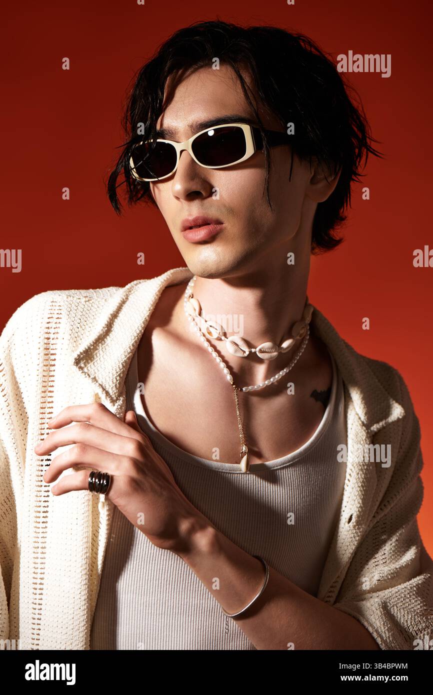 Slim young man wears a fashionable summer outfit while confidently ...