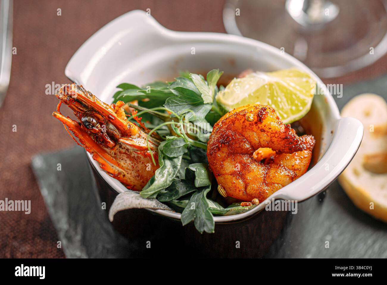 Portion of delicacy royal shrimp with toasted bread Stock Photo - Alamy