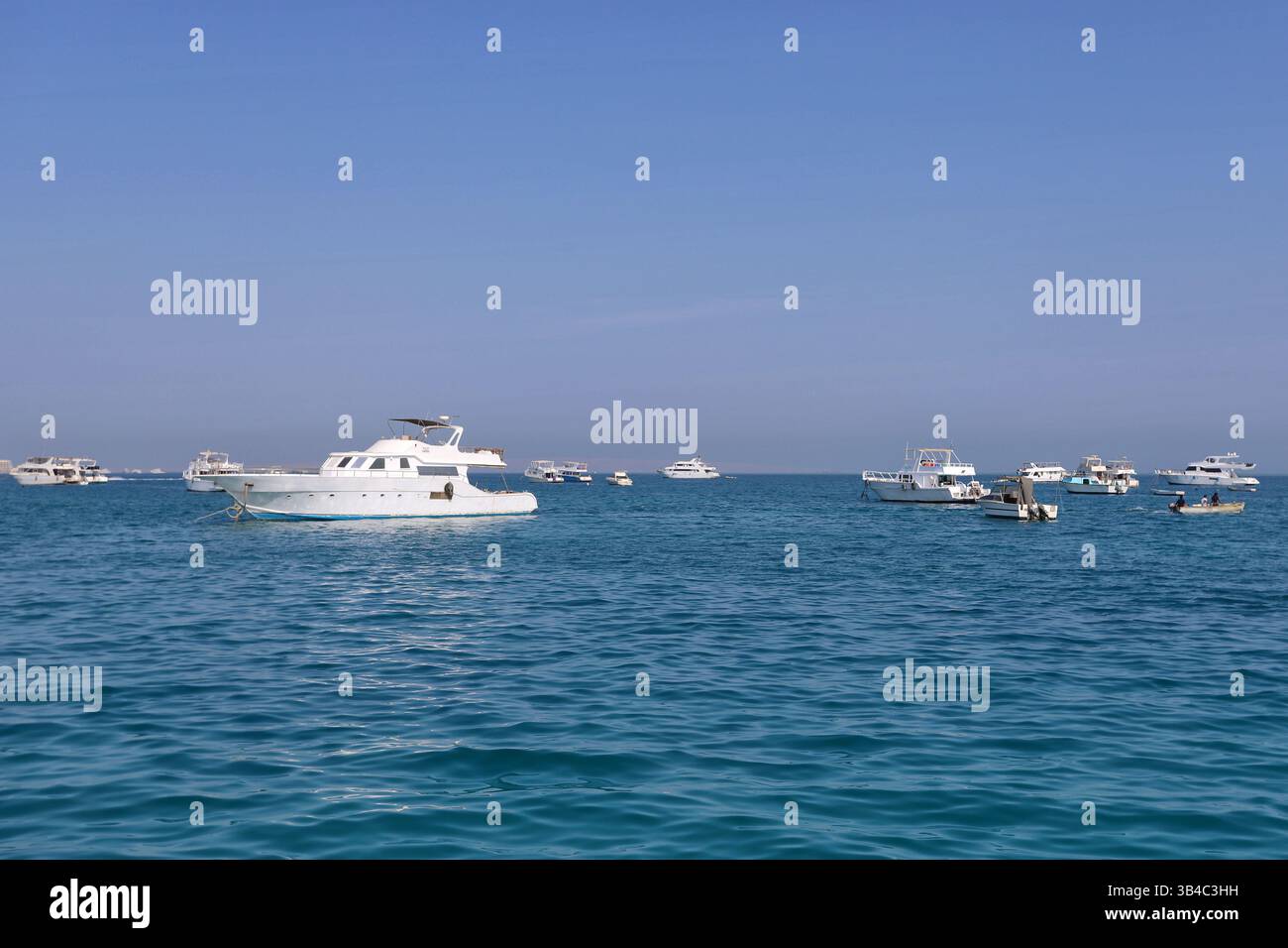 Yachts and Boats Anchored in the Red Sea under Clear Blue Sky, Egypt ...